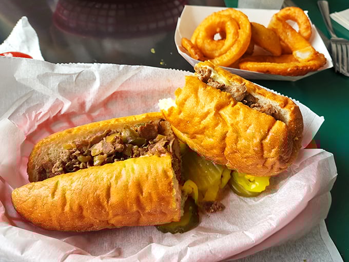 The legendary Philly cheese steak in all its glory&mdash;tender meat, melted cheese, and those perfectly golden onion rings on the side. Napkins: non-negotiable.