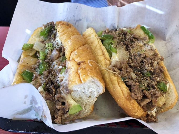 Behold the star attraction: thinly sliced seasoned beef, perfectly melted cheese, and green peppers nestled in a roll that's both sturdy and yielding.