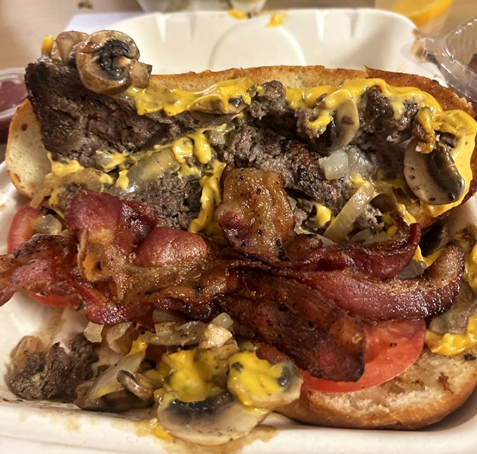 The star of the show: a Philly cheesesteak so gloriously messy it requires strategic eating and zero concern for shirt stains.