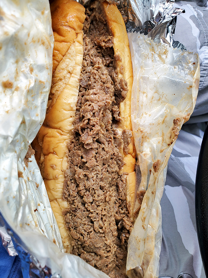 Behold the star attraction &ndash; thinly sliced ribeye packed into a perfect roll, the kind of cheesesteak that haunts your dreams.