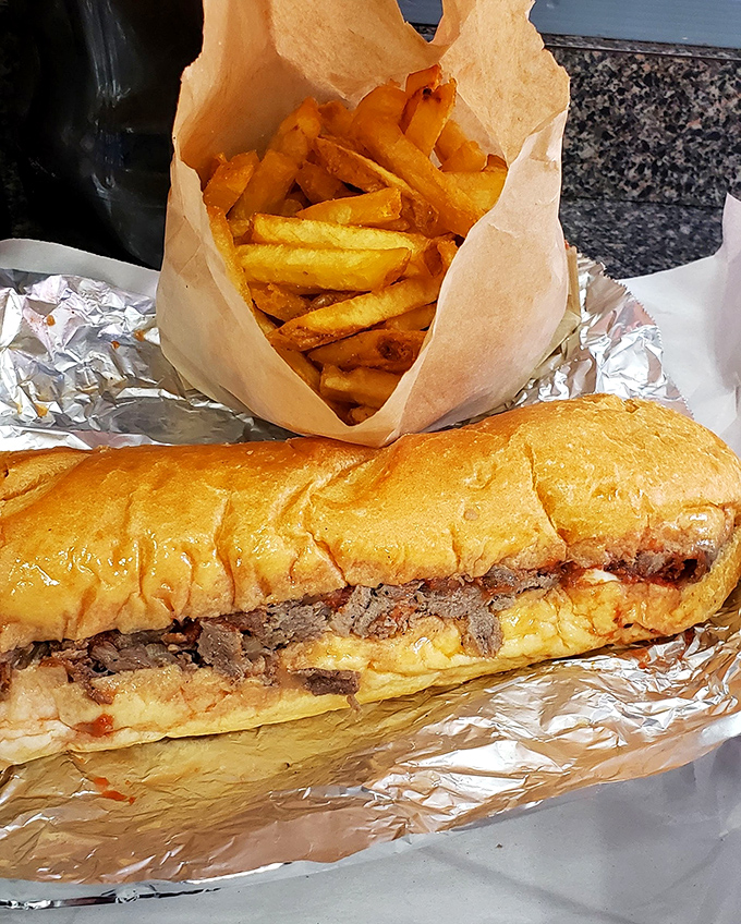 Behold the holy grail of Pennsylvania sandwiches &ndash; thinly sliced beef and melted cheese cradled in a perfect roll with those golden fries standing guard.