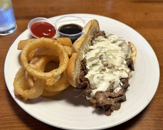 This Philly cheesesteak would make Rocky himself throw in the towel – tender ribeye, melted cheese, and a roll that's traveled further than most passports.