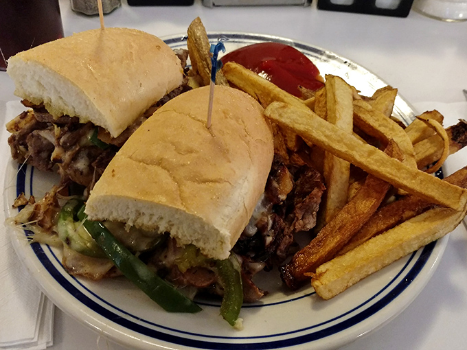 Behold the star of the show: Johnny's Philly cheesesteak with hand-cut fries. That perfect meat-to-cheese ratio isn't just a sandwich&mdash;it's edible poetry.