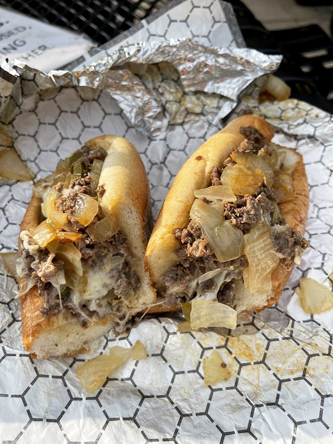 Behold the star attraction: thinly chopped steak, melted cheese, and caramelized onions on a perfect roll. Poetry in sandwich form.