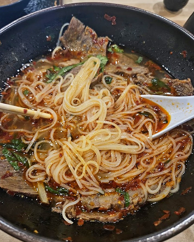 This steaming bowl of noodle soup isn't just comfort food&mdash;it's a hug in liquid form, with tender beef and herbs dancing in perfect harmony.