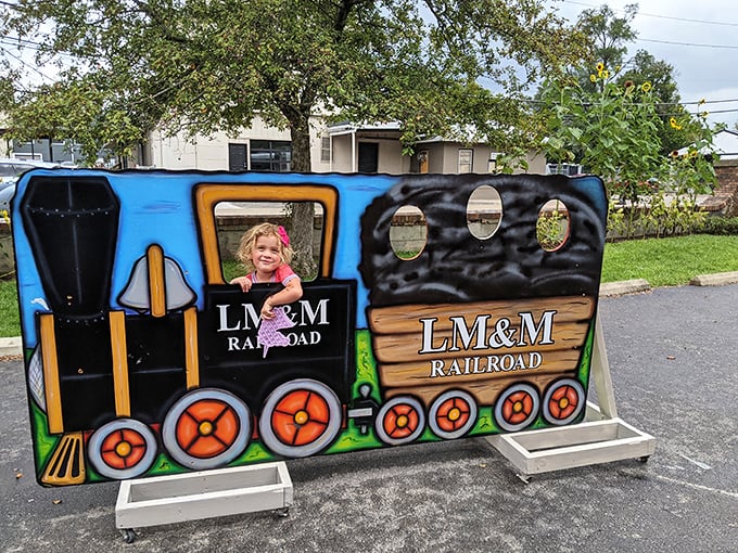 The LM&M Railroad's photo cutout provides the perfect family photo op &ndash; because nothing says "I had a great day" like pretending to be a tiny train conductor.
