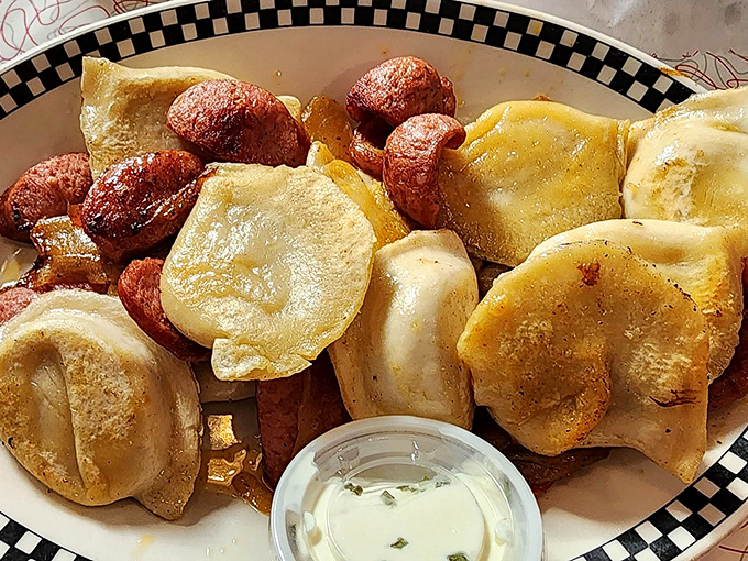 Golden-brown pierogies sharing a plate with kielbasa&mdash;a match made in heaven that would make your Eastern European ancestors weep with joy.