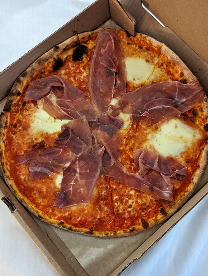 This prosciutto-topped masterpiece isn't just pizza&mdash;it's edible architecture where each slice delivers that perfect balance of crispy, chewy, salty, and sublime.