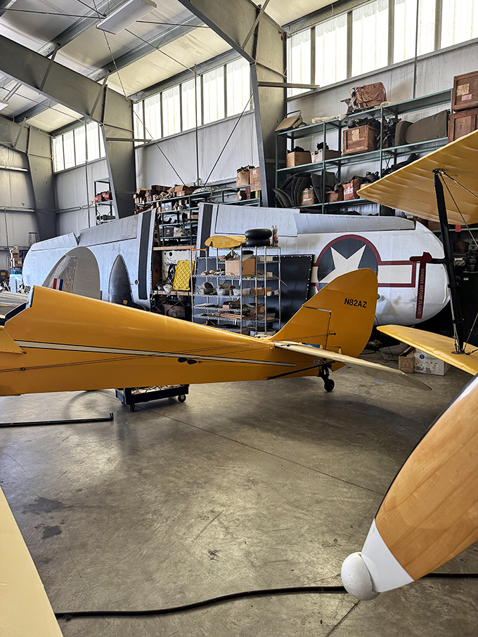 Inside the restoration hangar, aircraft in various stages of rebirth wait patiently as skilled hands bring them back to their former glory.