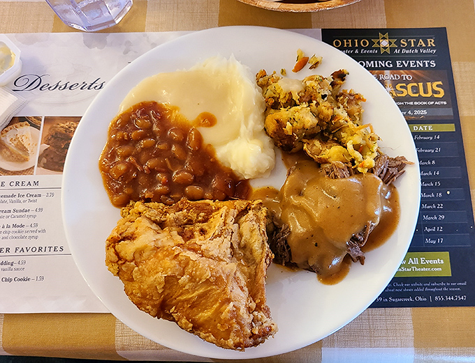 Behold the holy trinity of comfort: golden fried chicken, mashed potatoes swimming in gravy, and roast beef that practically dissolves on contact with your fork.