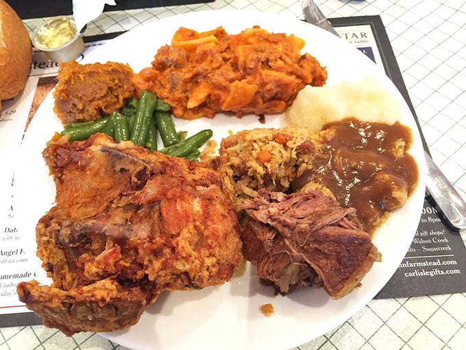 A plate that answers the eternal question: "Why choose one meat when you can have three?" The fried chicken alone would make your grandmother question her recipe.