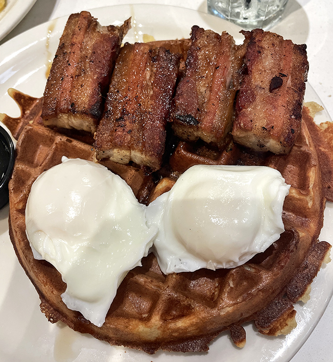 Behold the pork belly waffle in its natural habitat&mdash;crispy, savory, sweet, and topped with poached eggs that ooze perfection when pierced.