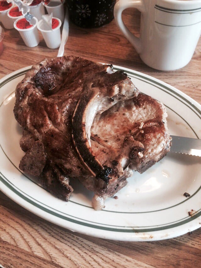 Behold the star of the show! This pork chop isn't just thick &ndash; it's the bodybuilder of pork chops, with a perfect sear that should be in a museum.