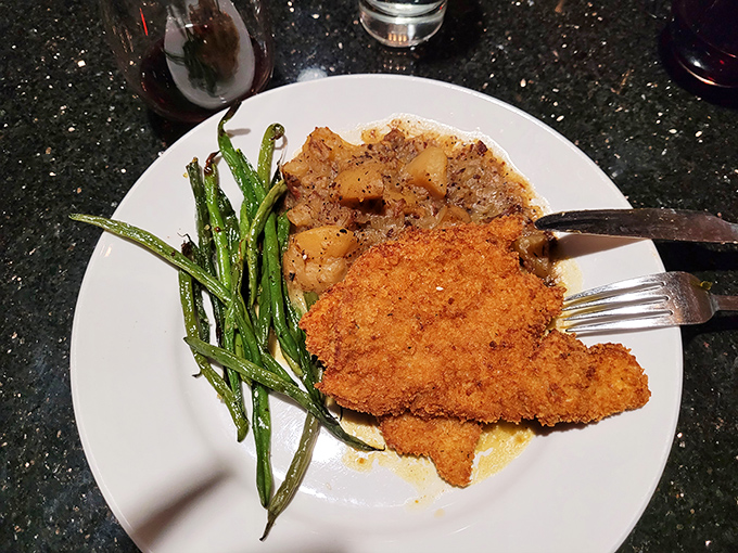Golden-brown perfection on a plate! This pork schnitzel's audible crunch should win a Grammy for "Best Sound in a Supporting Meal."