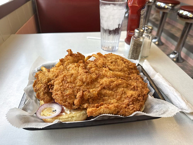 Behold the legendary pork tenderloin&mdash;a golden-fried masterpiece so massive it makes the bun look like it's playing a supporting role.