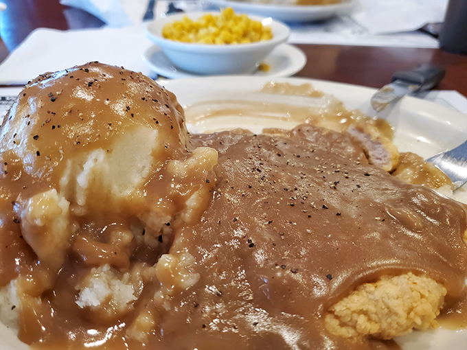Country-fried heaven on a plate. That gravy cascading over tender meat and potatoes could make even your cardiologist momentarily reconsider their profession.