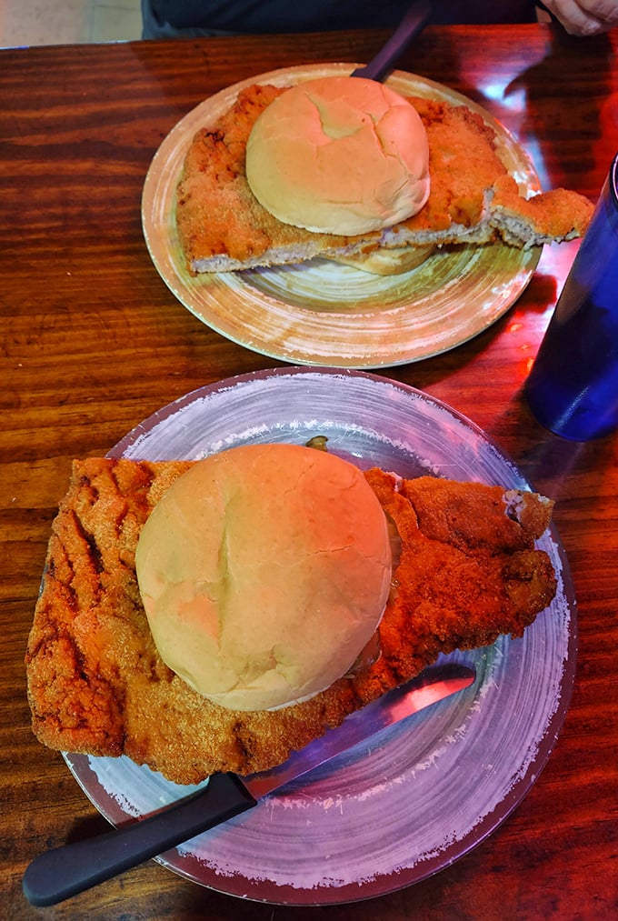 The infamous pork tenderloin in all its glory&mdash;a masterpiece of meat that makes the bun look like it's playing a supporting role in a blockbuster film.