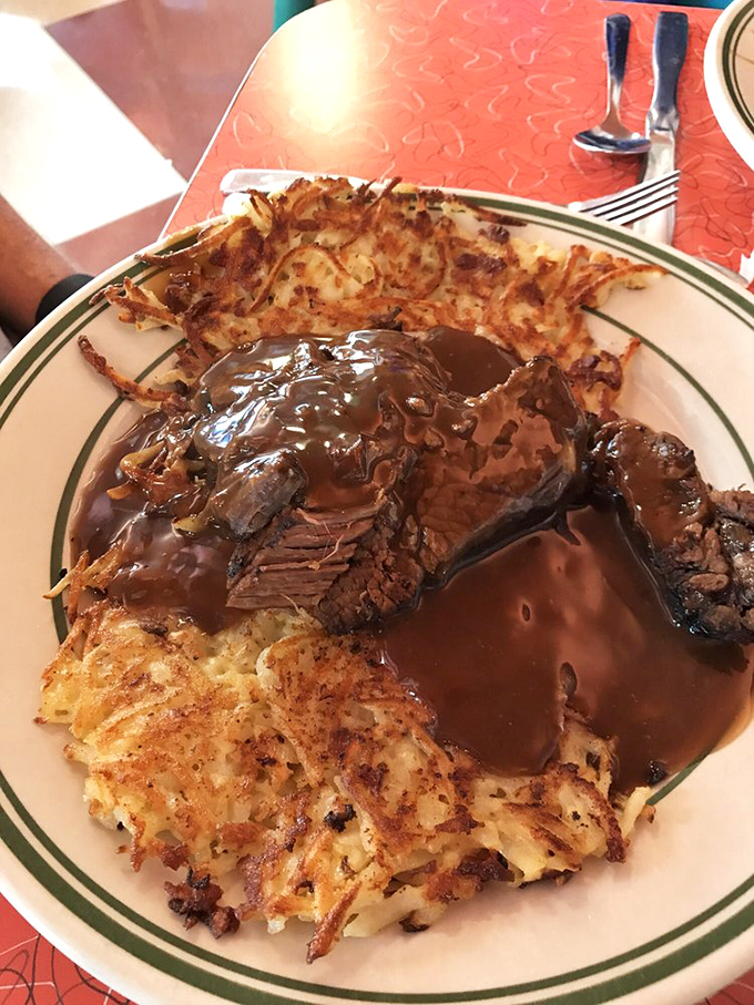 Pot roast for breakfast? Absolutely revolutionary. Tender beef swimming in gravy alongside crispy hash browns&mdash;morning comfort that hugs your soul.
