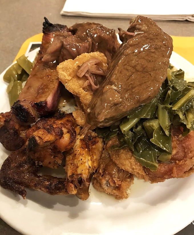 A plate that tells the whole story &ndash; smoked ribs, pot roast, fried chicken, and collard greens coexisting in perfect harmony like the world's most delicious family reunion.