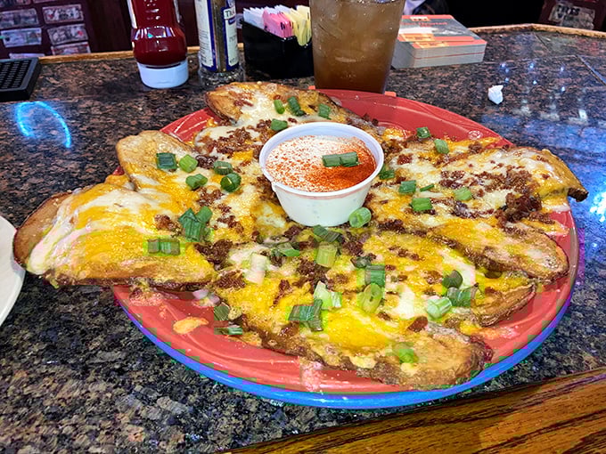 These loaded potato skins aren't just appetizers; they're edible treasure maps where X marks the spot with bacon, cheese, and green onions.