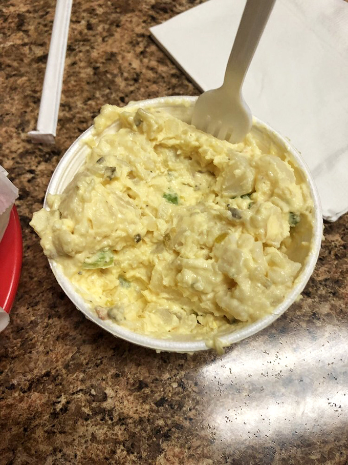 Potato salad that doesn't apologize for being exactly what it should be: creamy, substantial, and ready to support your sandwich in its moment of glory.