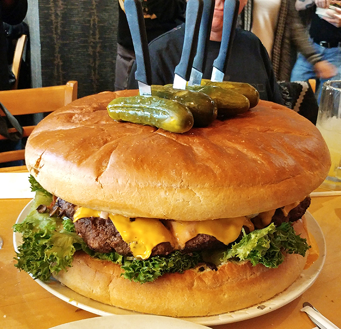 Not so much a burger as a skyscraper of beef with its own zip code. Those pickles aren't garnish &ndash; they're structural support.