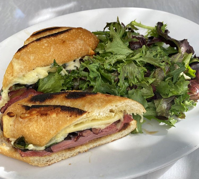 The pressed duck sandwich isn't just lunch&mdash;it's an event. Perfectly grilled bread embracing tender duck meat with melty cheese and fresh greens. Worth crossing county lines for.