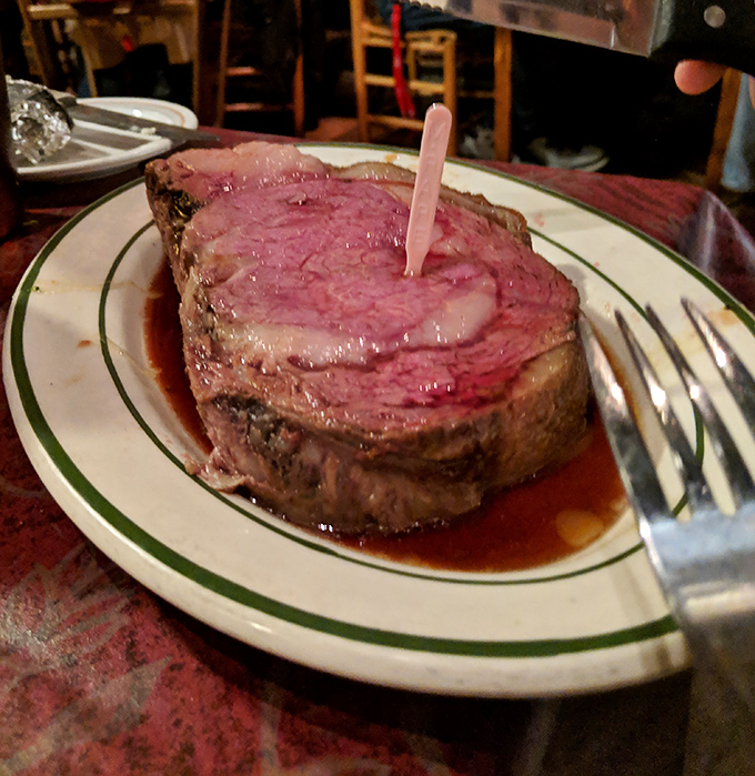 This prime rib isn't just dinner—it's a religious experience. Pink, perfect, and swimming in jus that you'll be tempted to drink.