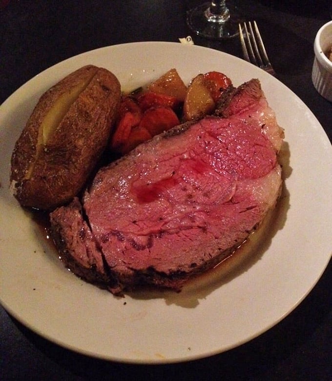 Behold the star of the show: prime rib so perfectly pink it makes even seasoned carnivores pause for a moment of reverent silence.