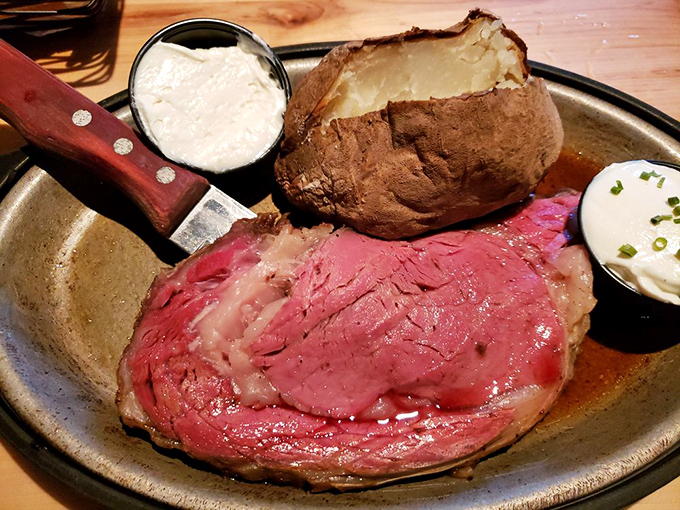 Behold the star of the show: prime rib so perfectly roasted it makes vegetarians question their life choices. That baked potato isn't just a side&mdash;it's a co-star.