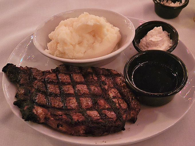 This isn't just a steak; it's a declaration of independence from food fads. Perfectly seared, served with creamy mashed potatoes and savory au jus.