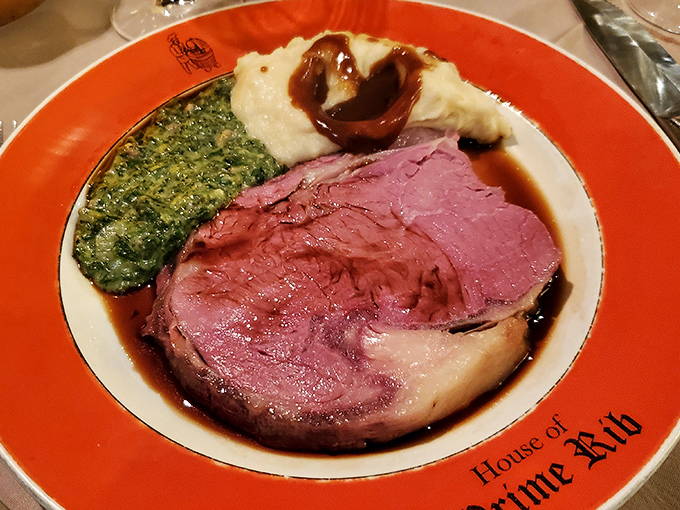 Behold the main event: perfectly rosy prime rib alongside creamed spinach and Yorkshire pudding. This plate doesn't need Instagram – it needs your undivided attention.