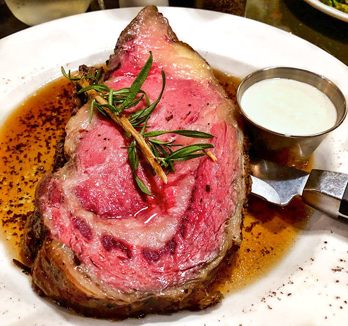 This prime rib isn't just dinner; it's a religious experience. Perfectly pink, herb-garnished, and accompanied by its natural juices.