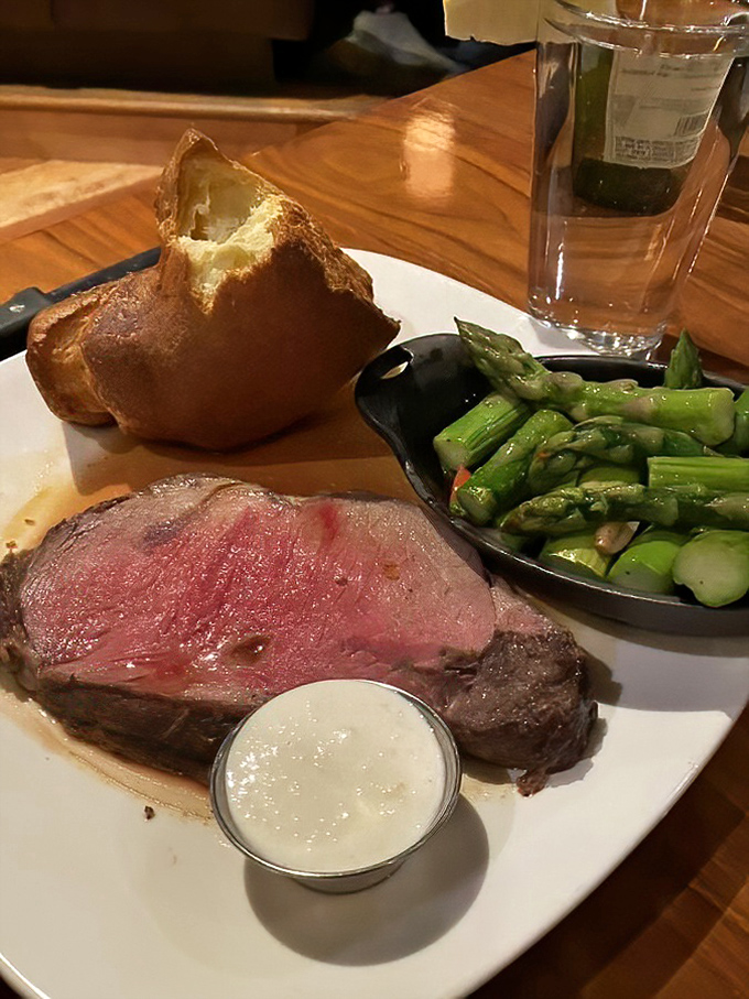 Behold the prime rib in all its glory &ndash; perfectly pink, accompanied by a popover that's practically begging to soak up that savory jus.