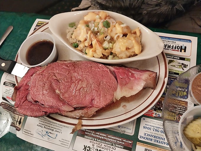 This isn't just prime rib&mdash;it's a masterpiece of meat, perfectly pink and paired with what appears to be a loaded potato side that's practically begging to be devoured.
