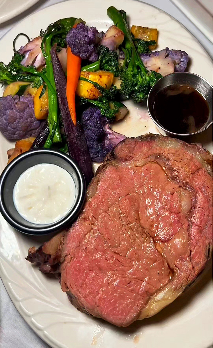 A perfectly medium-rare prime rib alongside colorful seasonal vegetables. This isn't just dinner&mdash;it's edible artwork with a side of pure joy.