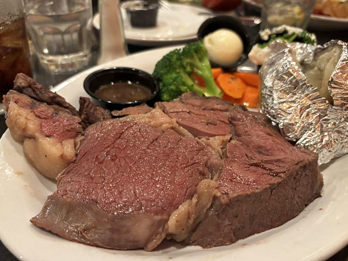 Prime rib so perfectly pink it should have its own Instagram filter. Those vegetables are just there to ease your conscience.