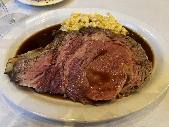 Behold the star of the show—prime rib in all its glory. That perfect pink center surrounded by a seasoned crust is what dreams are made of.