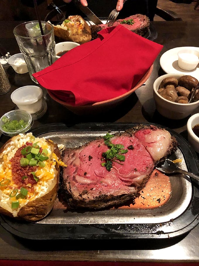 Prime rib so perfectly pink it should have its own Instagram account. That loaded baked potato isn't exactly camera-shy either.