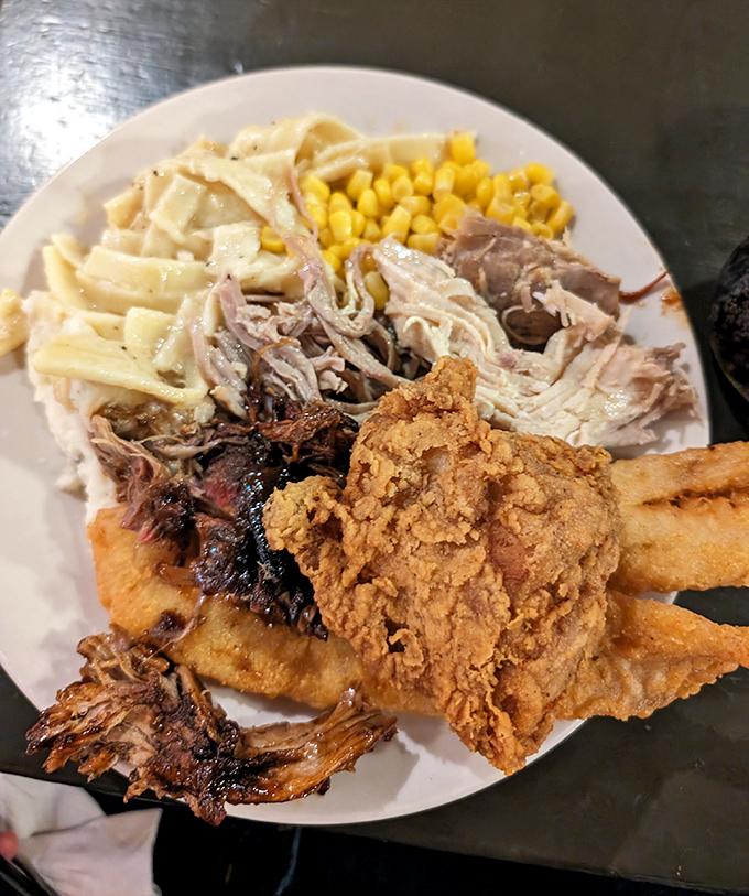 The star of the show: pulled pork sharing a plate with crispy chicken, noodles, and corn. A harmony of textures that sings in perfect Midwestern tune.