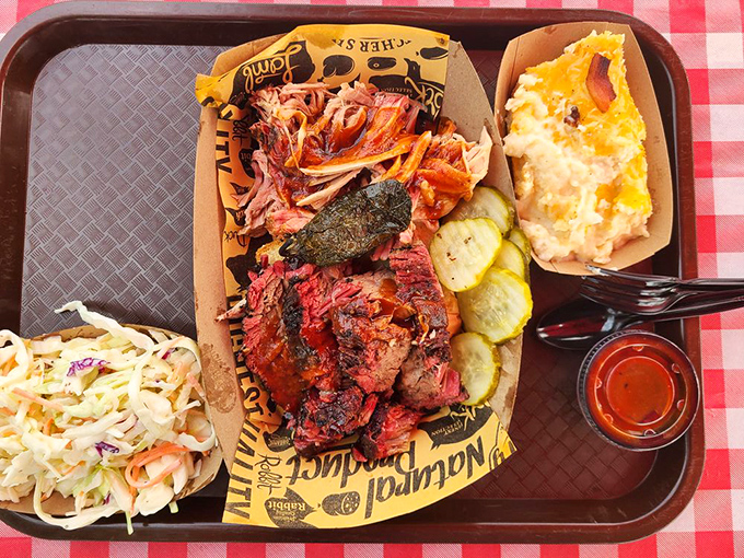 A barbecue tray that hits all the right notes &ndash; smoky meat, creamy sides, and those pickles that cut through the richness like a well-timed joke.
