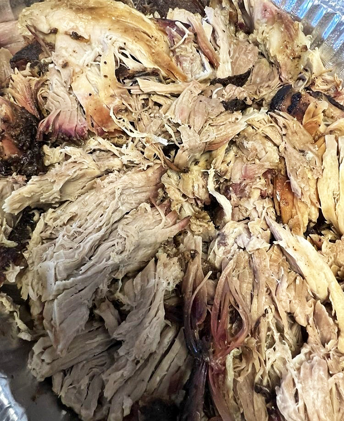 Behold the holy grail of pulled pork &ndash; tender strands of smoky goodness that surrender at the mere sight of a fork.