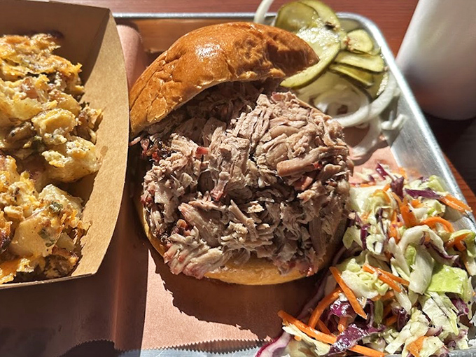 This pulled pork sandwich isn't just a meal, it's a masterclass in texture &ndash; tender strands of smoky meat practically begging to be devoured.