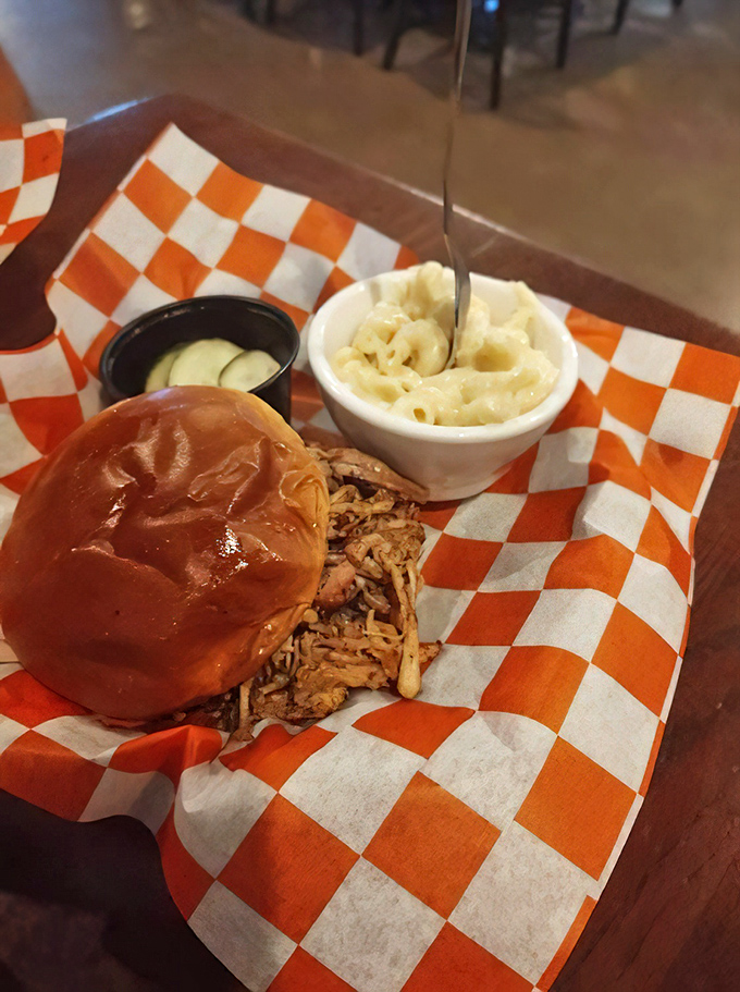 Not all heroes wear capes; some come on brioche buns. This pulled pork sandwich with mac and cheese might just make you weep with joy.