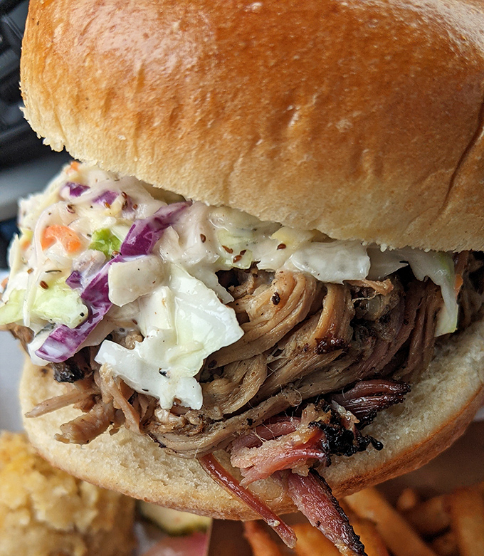 This pulled pork sandwich, crowned with creamy slaw, is what barbecue dreams are made of. The perfect marriage of smoke, meat, and tang.