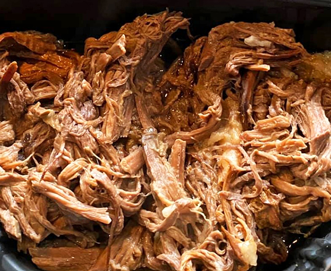 Pulled pork so tender it practically surrenders to your fork. This isn't just meat&mdash;it's a masterclass in patience and smoke.