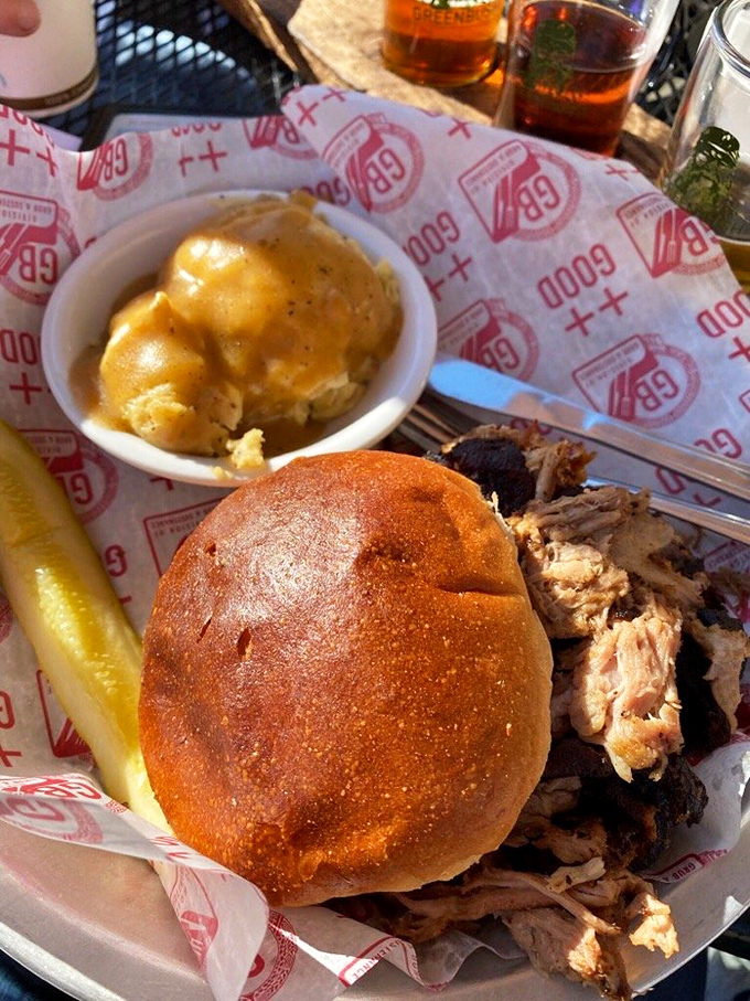 This pulled pork sandwich isn't just food; it's edible poetry. The mac and cheese side isn't playing second fiddle&mdash;it's conducting its own symphony.