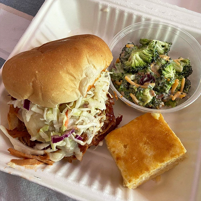 The star of the show: Hood's pulled pork sandwich with crisp slaw and a side of broccoli salad. This is what happiness looks like on a plate.