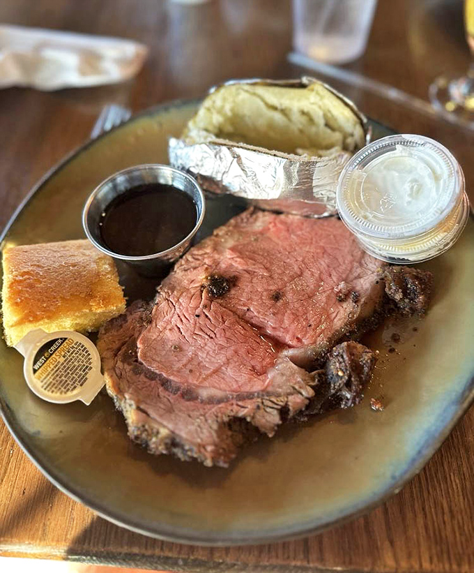 Behold the queen cut prime rib - thick, juicy perfection that makes vegetarians question their life choices entirely.