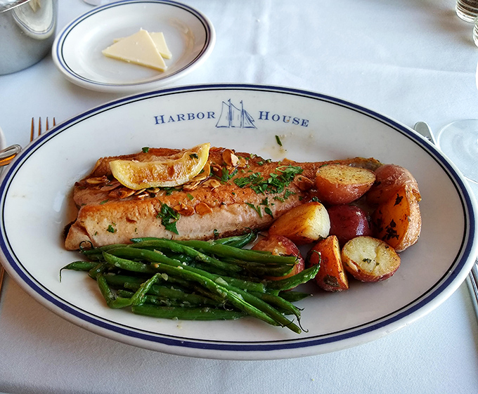 Rainbow trout that looks like it jumped from stream to plate, accompanied by green beans that actually taste like summer. Culinary simplicity at its finest.